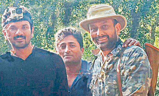 Guns ’n’ cameras! What’s this minister's son doing in a forest!