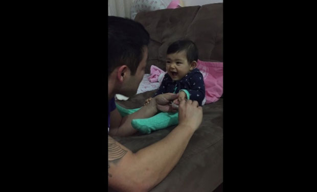 Watch: Adorable baby girl pulls fake cry prank on father