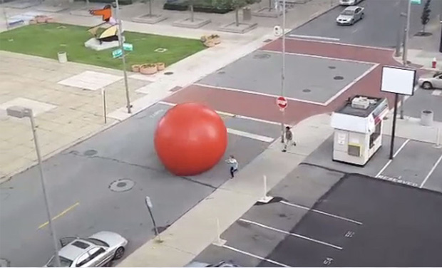Watch: Giant red ball gets loose, rolls through city