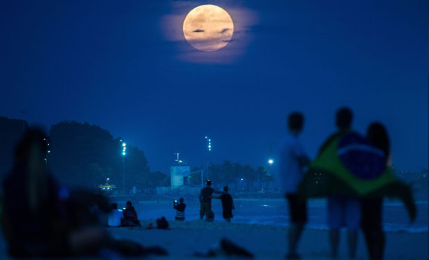Supermoon lights up skies around the world