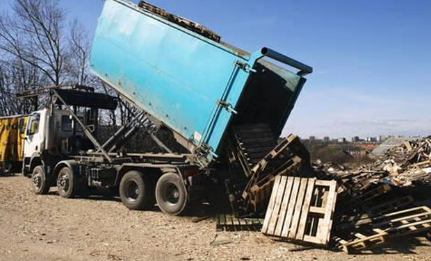 Man scooped up by California garbage truck survives ride