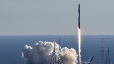 SpaceX recycled rocket soars with recycled capsule