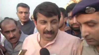 Delhi BJP workers protest over threat to Manoj Tiwari