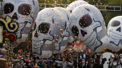 After Mexico quakes, Day of the Dead parade honours rescuers