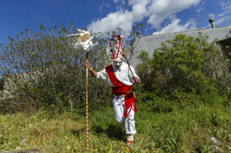 Spain celebrates colourful mask parade ahead of carnival celebrations