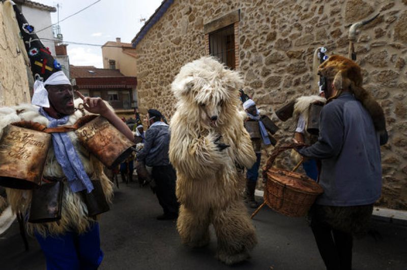Spain celebrates colourful mask parade ahead of carnival celebrations