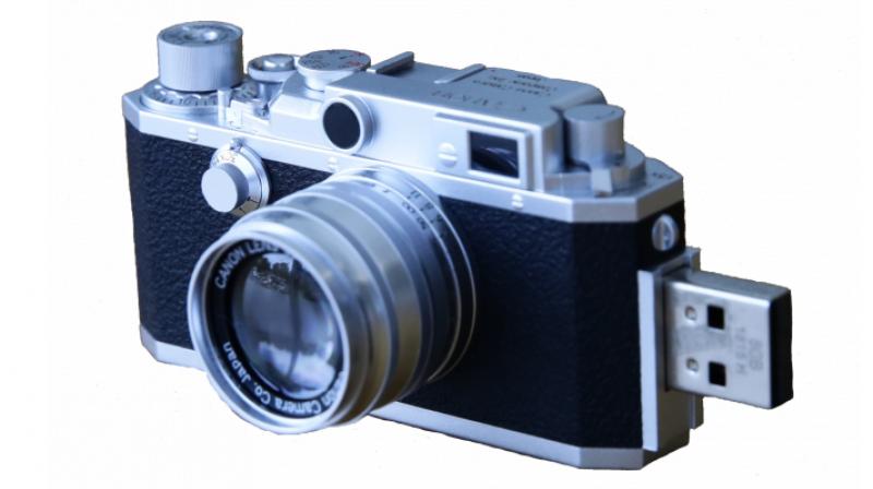 Are you interested in this miniature Canon camera with 8GB storage?