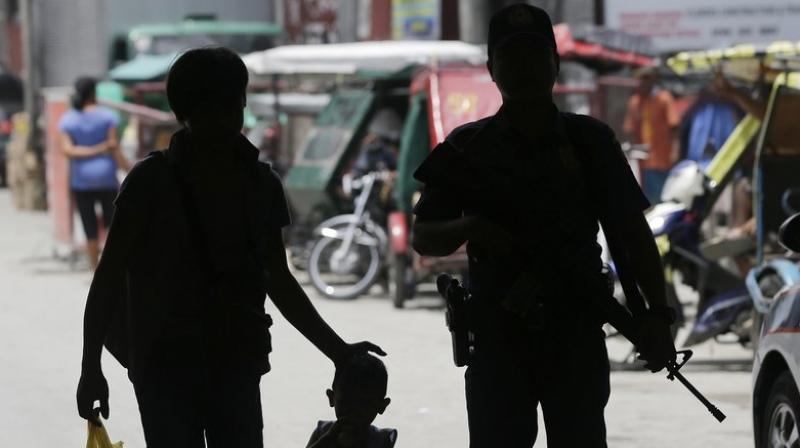 Priest among 14 hostages taken in siege of Philippines city