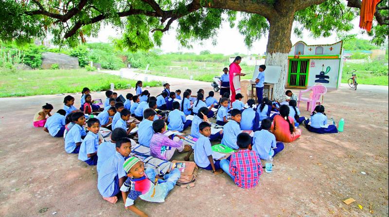 Students of Middle Fort in Warangal forced to sit under trees