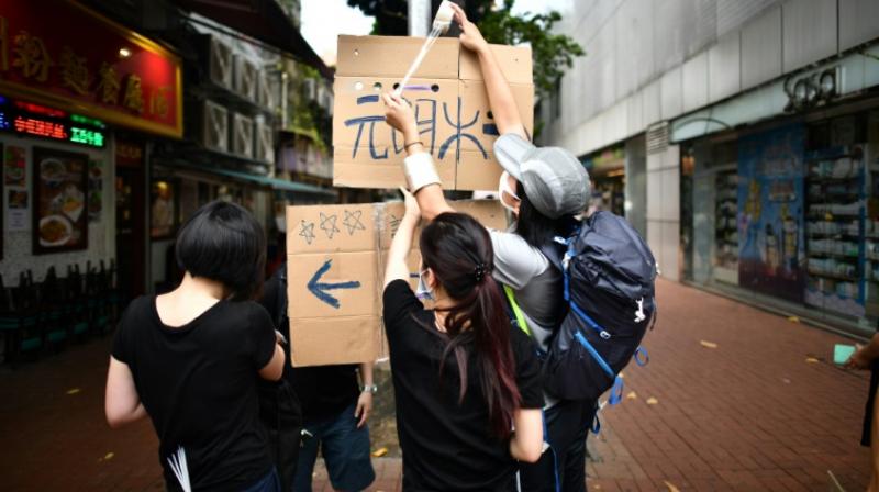 Hong Kongers defy police ban and gather for 'anti-triad' rally