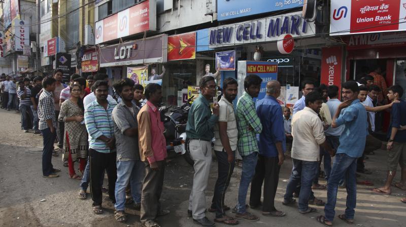 With banks closed on Sunday, long queues at ATMs in Mumbai