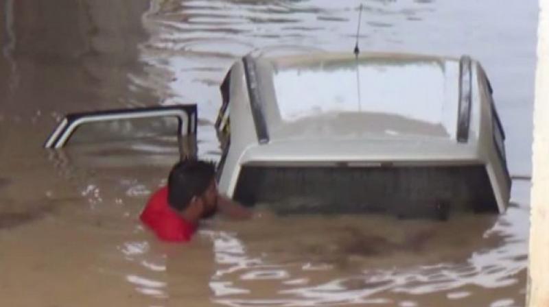 Rajasthan: Locals rescue 5 people from car stuck in waterlogged underpass