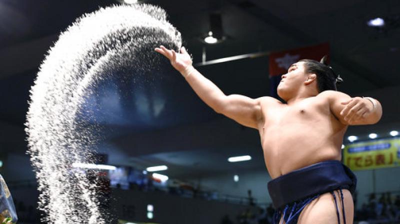 Foreign wrestler faces gruelling path to enter Japan's 15-century-old sport